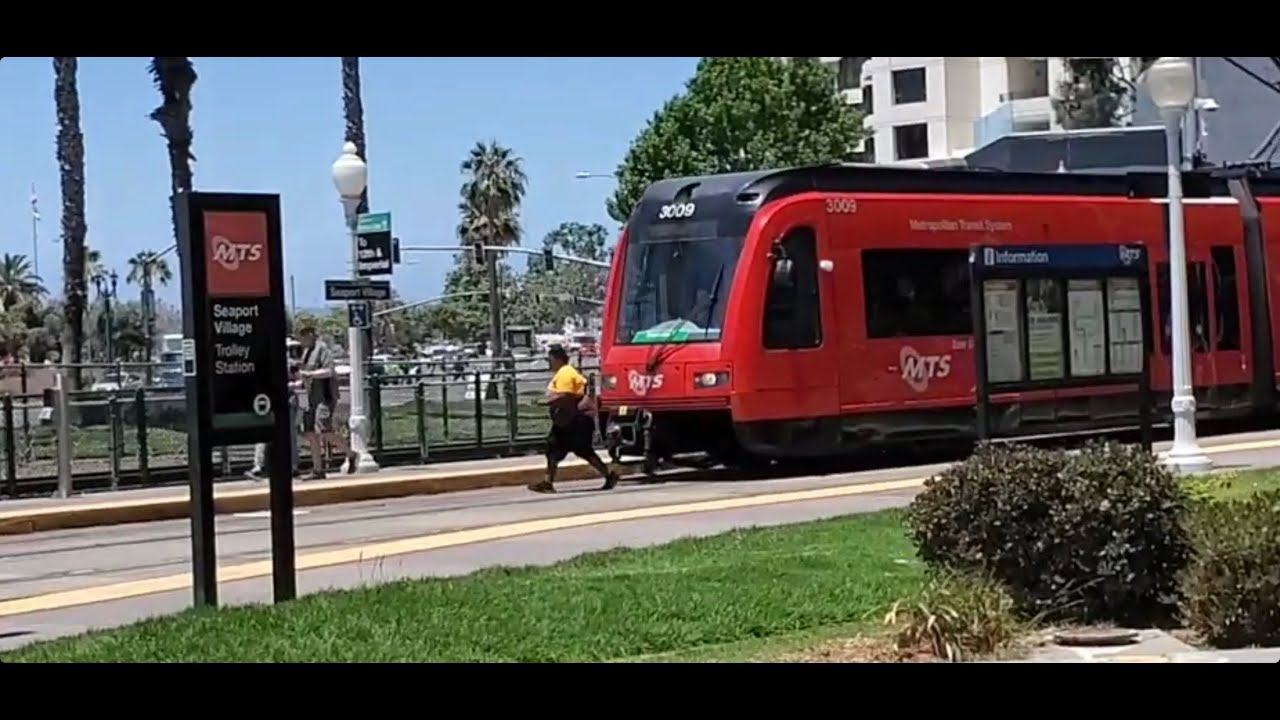 Woman nearly gets hit by a Trolley departing from a station - YouTube