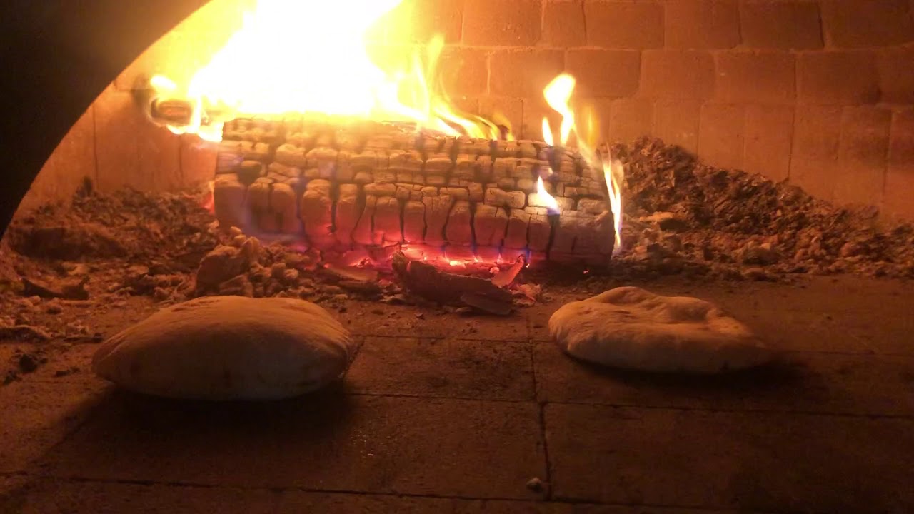 Wood-fired pita at Simcha restaurant in Sharon - YouTube