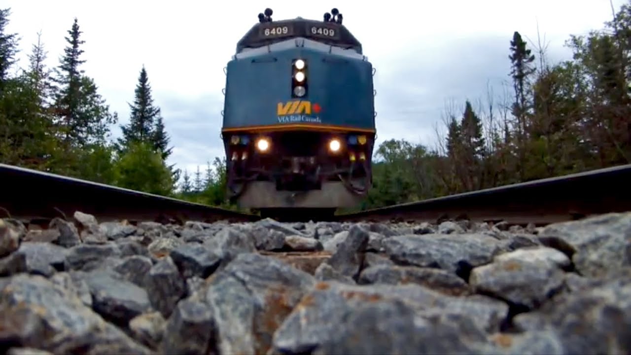 Train Rolling Over, Camera Middle of Track, Ground Level Underneath Car ...