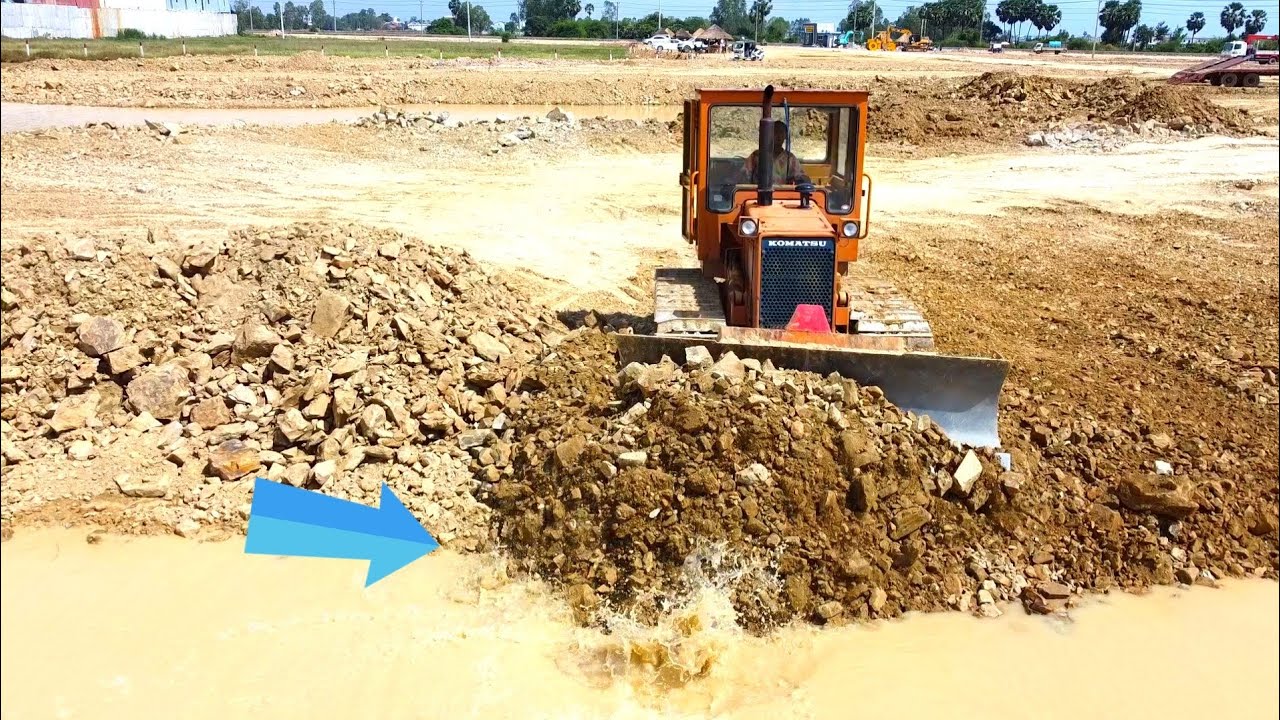 The Stronger Bulldozer Komat'su D-21-P working push stone into the ...