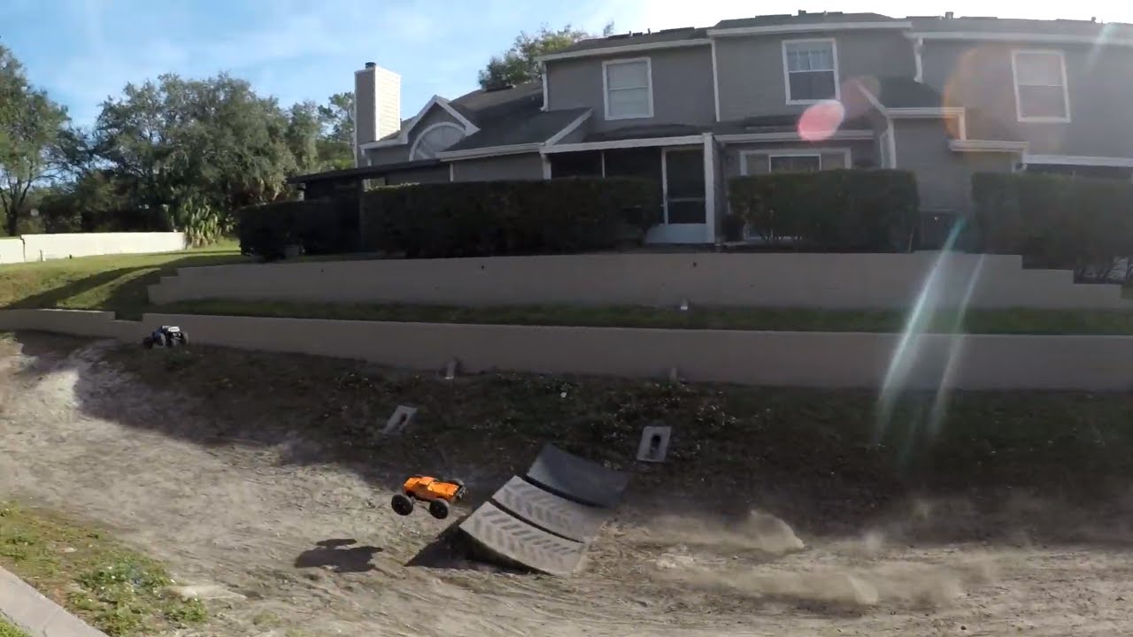 Traxxas Maxx and Arrma Outcast jumping ramps in the bash pit - YouTube