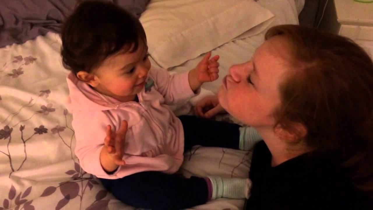 Baby Abigail plays with mom's cheeks - YouTube