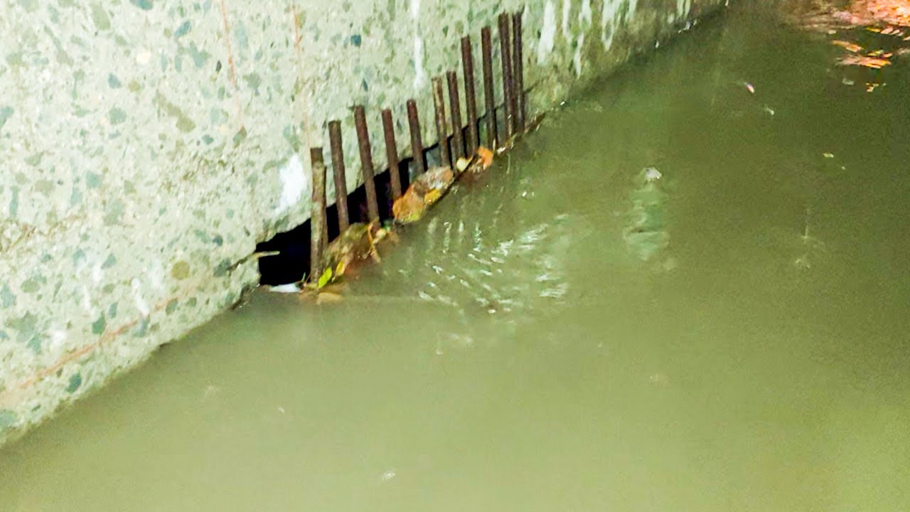 Unclogged Culvert Drain After Heavy Rain - Removal Leaves And Plastic ...