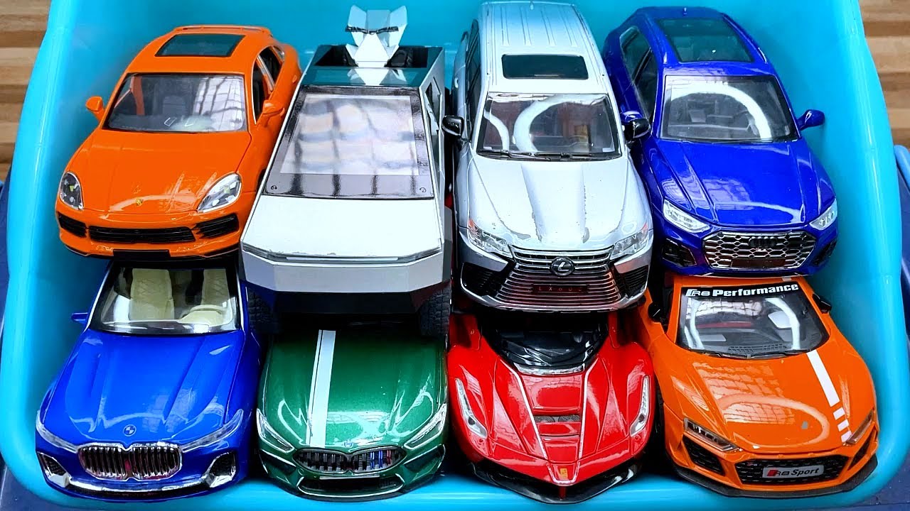 Box full of various miniature cars Jaguar, Peugeot, Renault, Hyundai ...