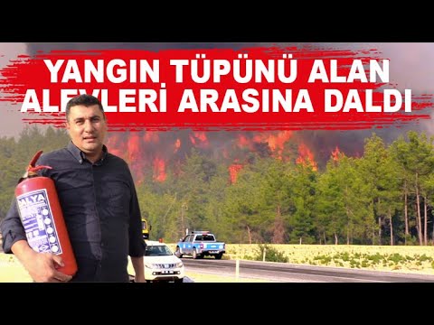 Yangın tüpünü alan alevlerin arasına daldı