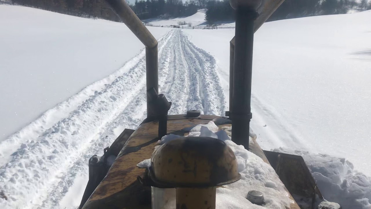 Cat D4 6u Plowing Snow - YouTube