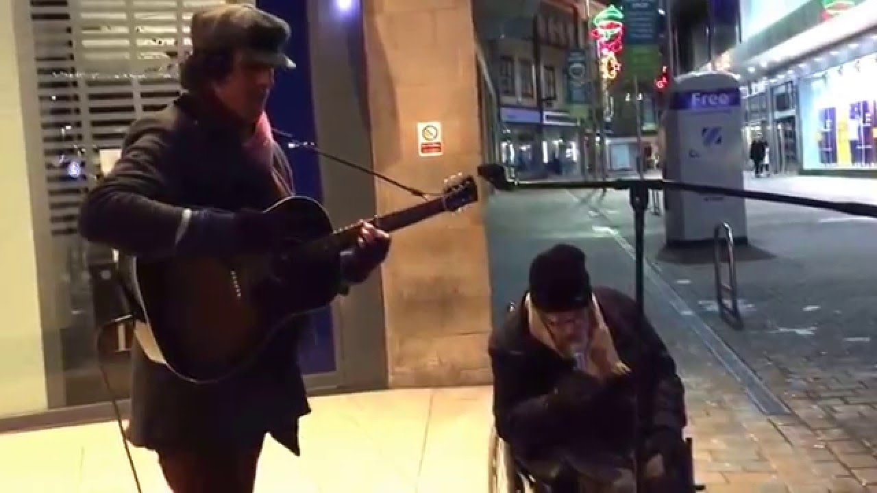 Homeless man joins busker for spontaneous New Year's Eve street jam ...