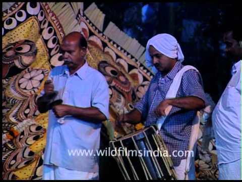 Padayani dancers wearing mask holding indigenous torches (Chootu-katte ...