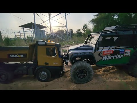 RC Warrior Truck Pushing HUINA Dump Truck on Sandy Terrain