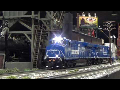 Lionel Legacy NS Conrail Heritage ES44AC's #1976 & #1978 pulling Intermodal at Corner Field ...