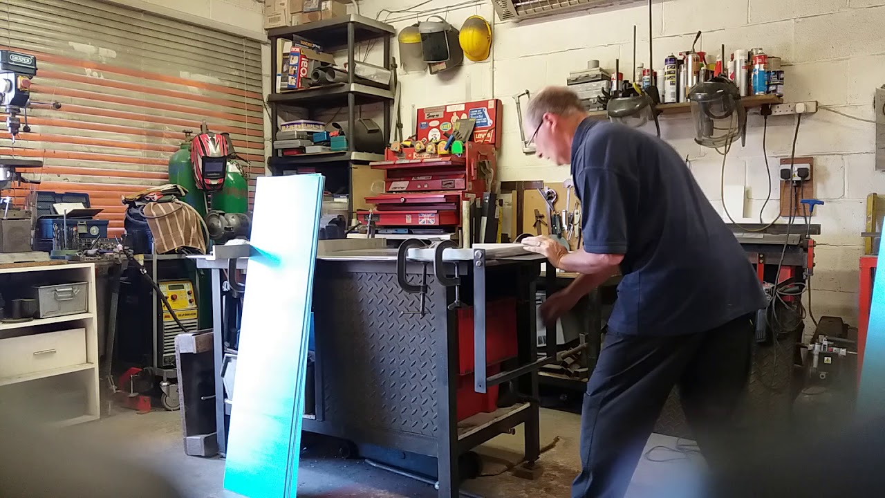 Bending a radiused edge on an aluminium sheet. - YouTube