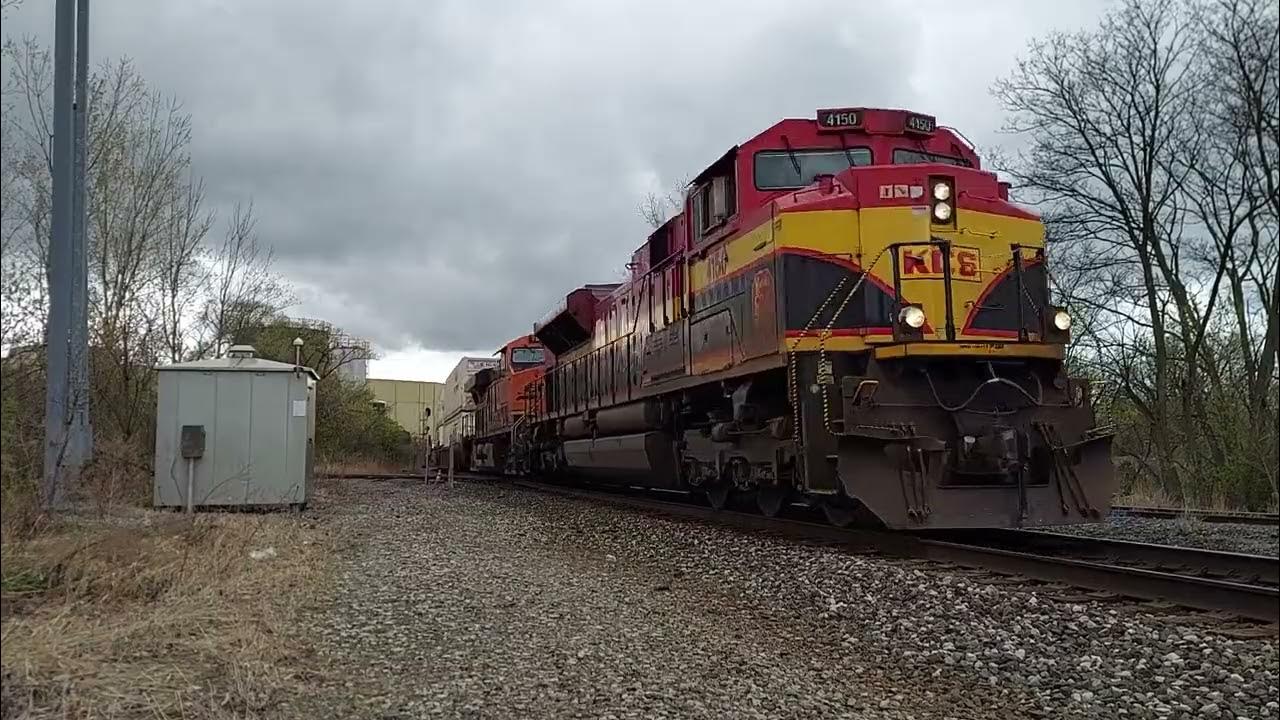 KCS SD70ACe 4150 leads NS 28B crossing the AK Diamond - YouTube