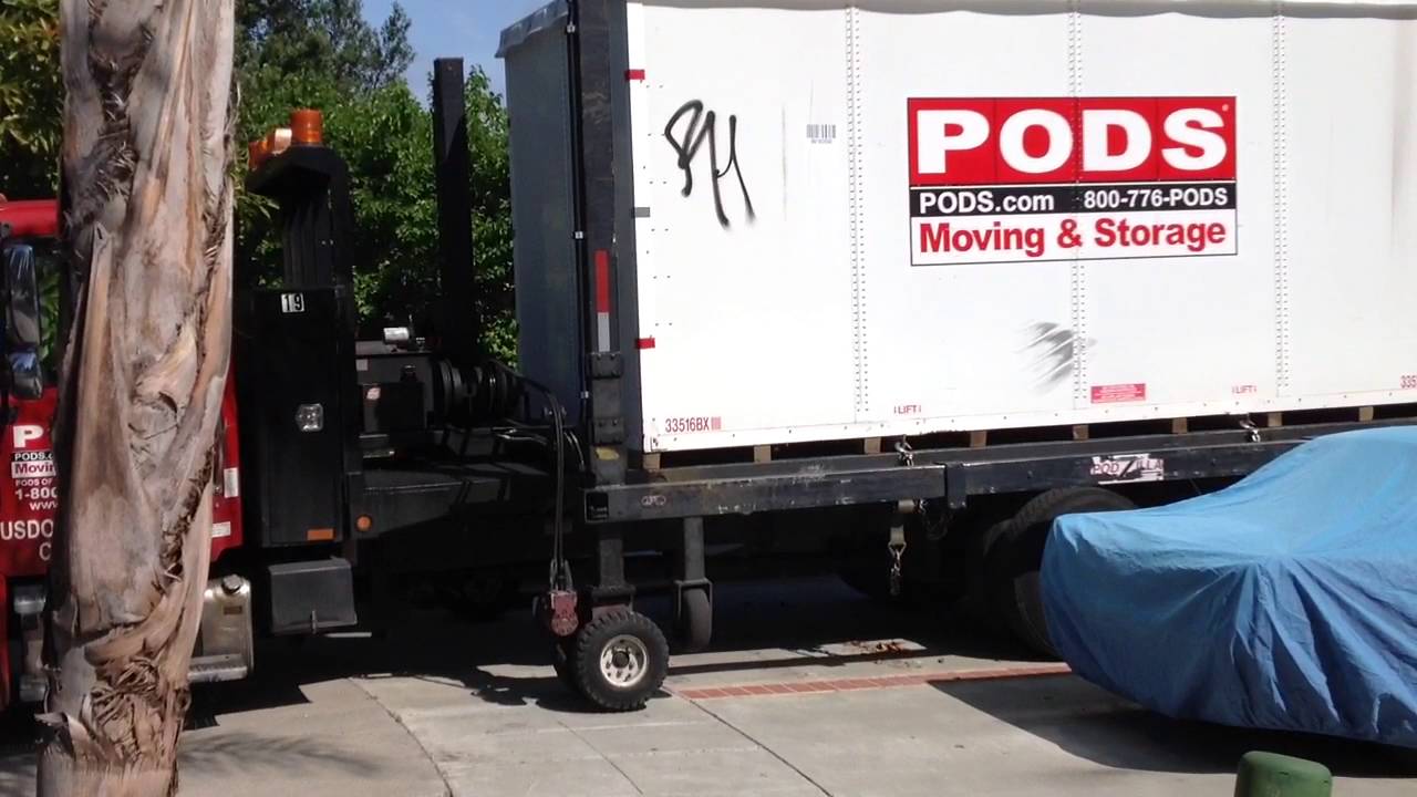 PODS hydraulic container lifter getting on truck. - YouTube