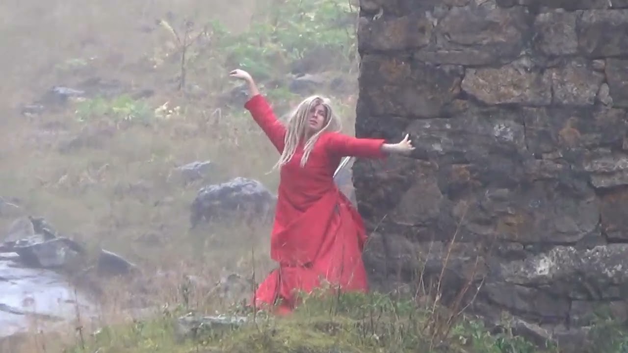 Seductive dance of legendary Huldra at the famous Kjosfossen Waterfall ...