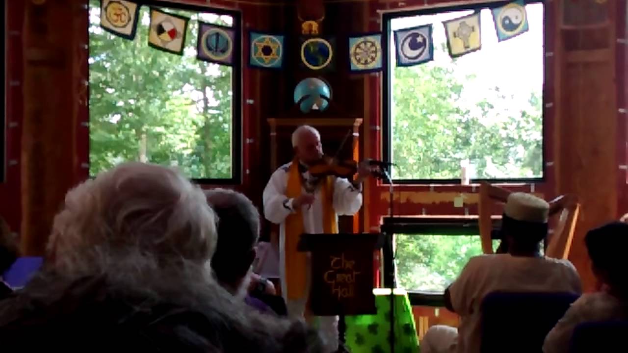 The Rev. Patrick McCollum plays the World Peace Violin at the Peace ...