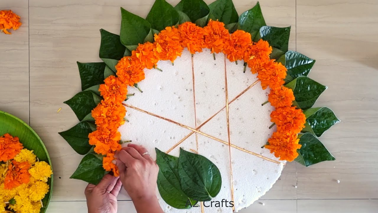 Betel Leaf Background Decoration Idea Varamahalakshmi Festival Decor Using Marigold Flowers betel-leaf-background-decoration-idea-varamahalakshmi-festival-decor-using-marigold-flowers