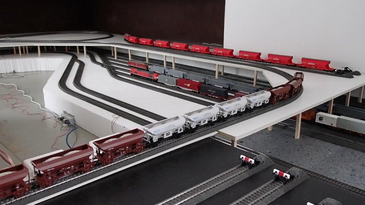 Class Re 620 locomotive meets several trains during morning traffic ...