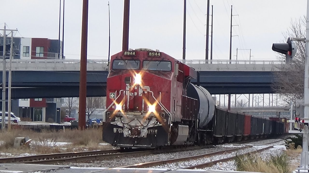 CPKC 252 with a fresh CSX DPU at Bettendorf and the ballpark Davenport ...