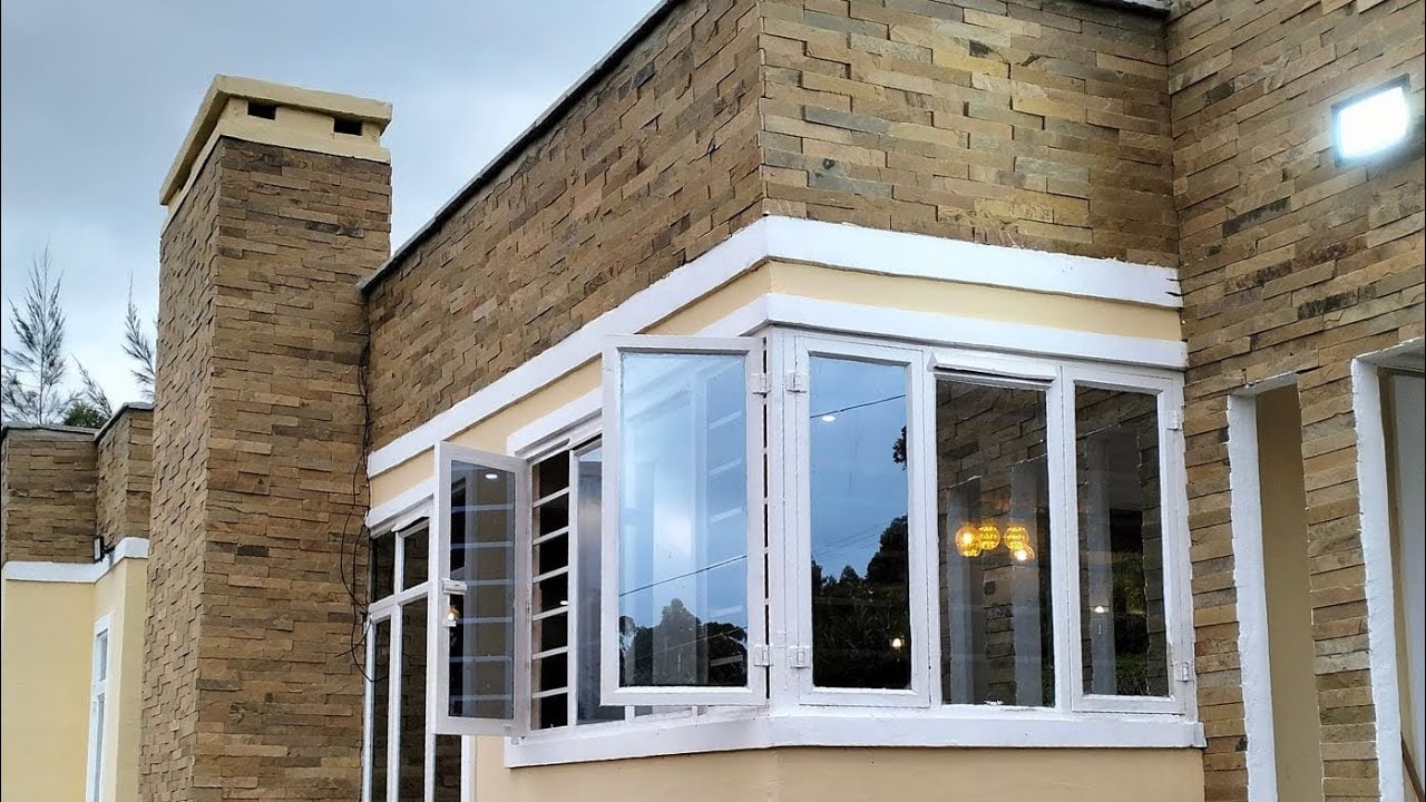 Mazeras Cladding on Precast House. - YouTube
