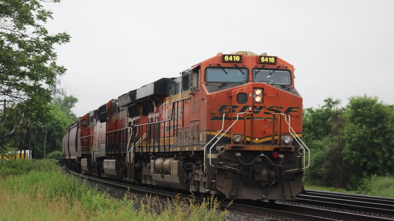 3 BNSF GE's power a CSX G107 on a rainy day - YouTube