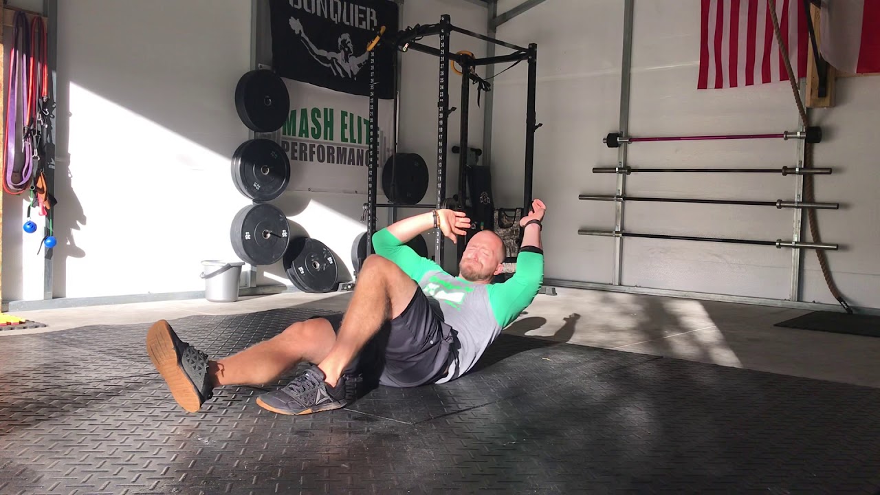 Sit up twist to one leg - YouTube