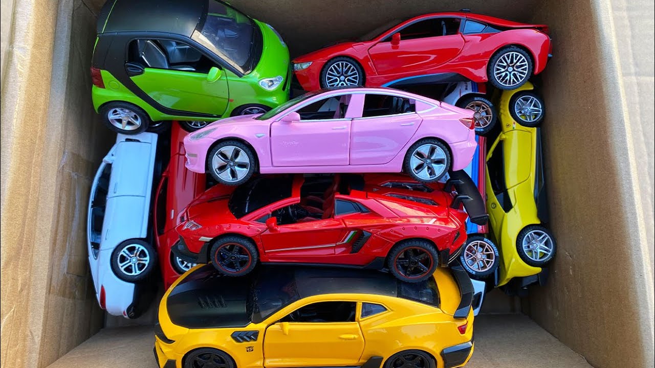 Box full of model Cars, Tesla, BMW, Smart fortwo, Lamborghini, Camaro ...