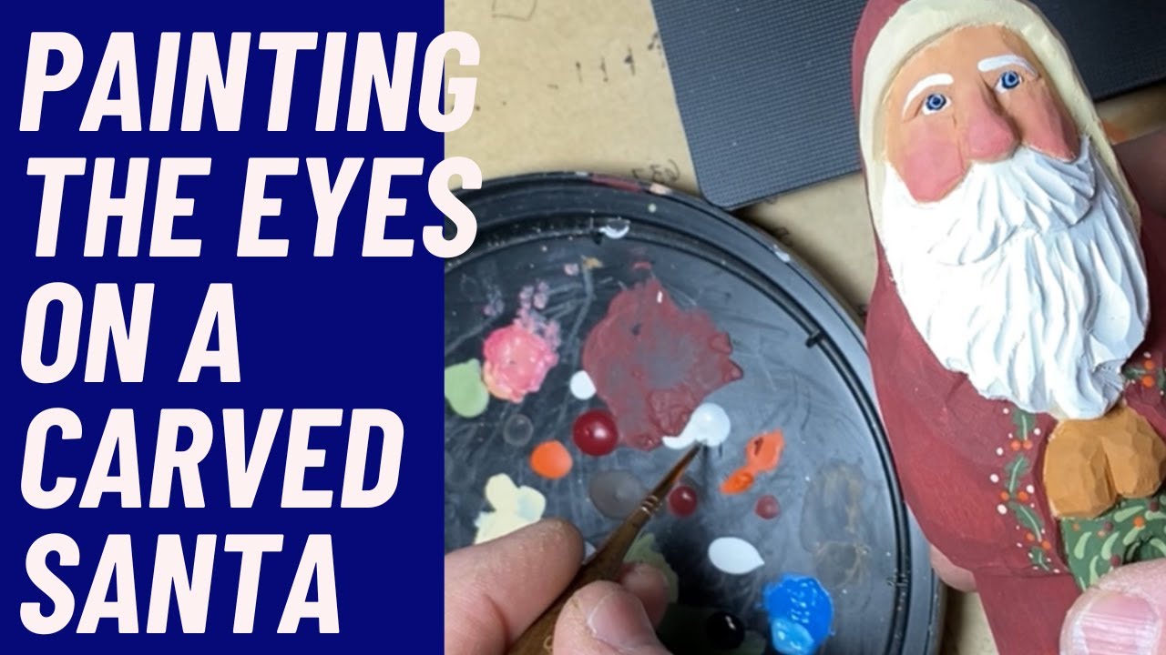 Painting the eyes on a carved Santa - YouTube