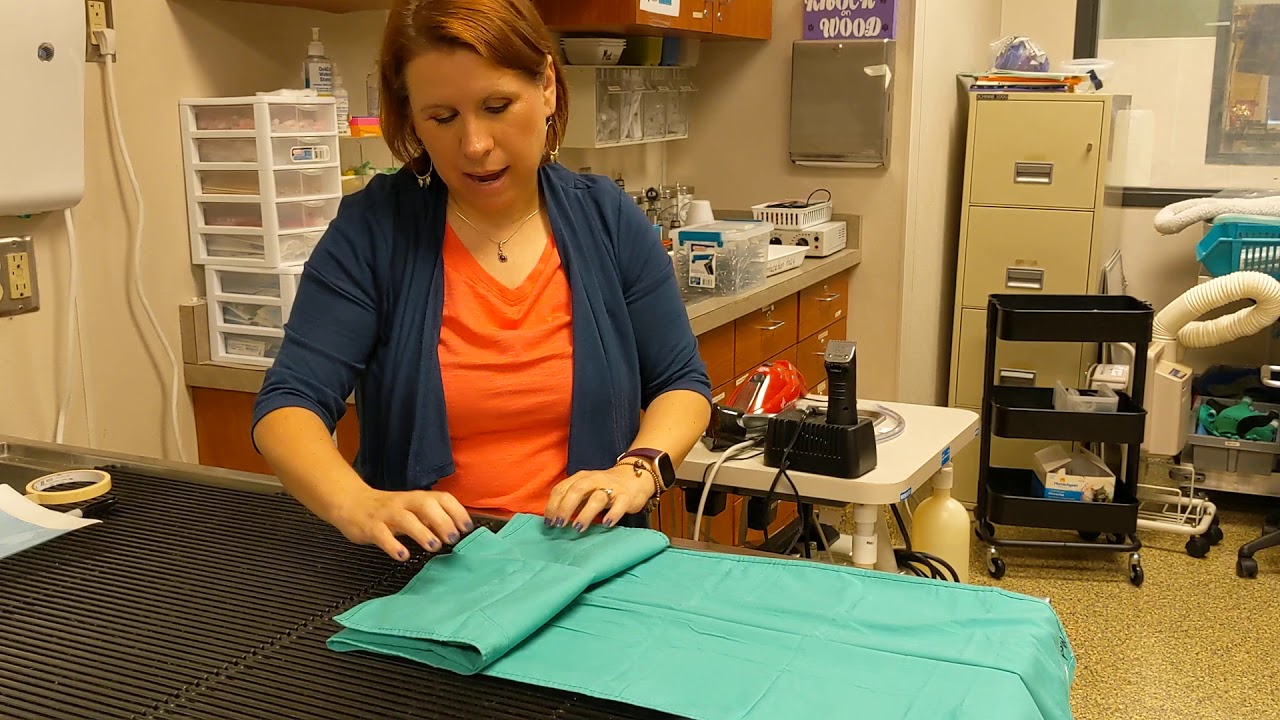 Folding and Packing Fenestrated Drape - YouTube