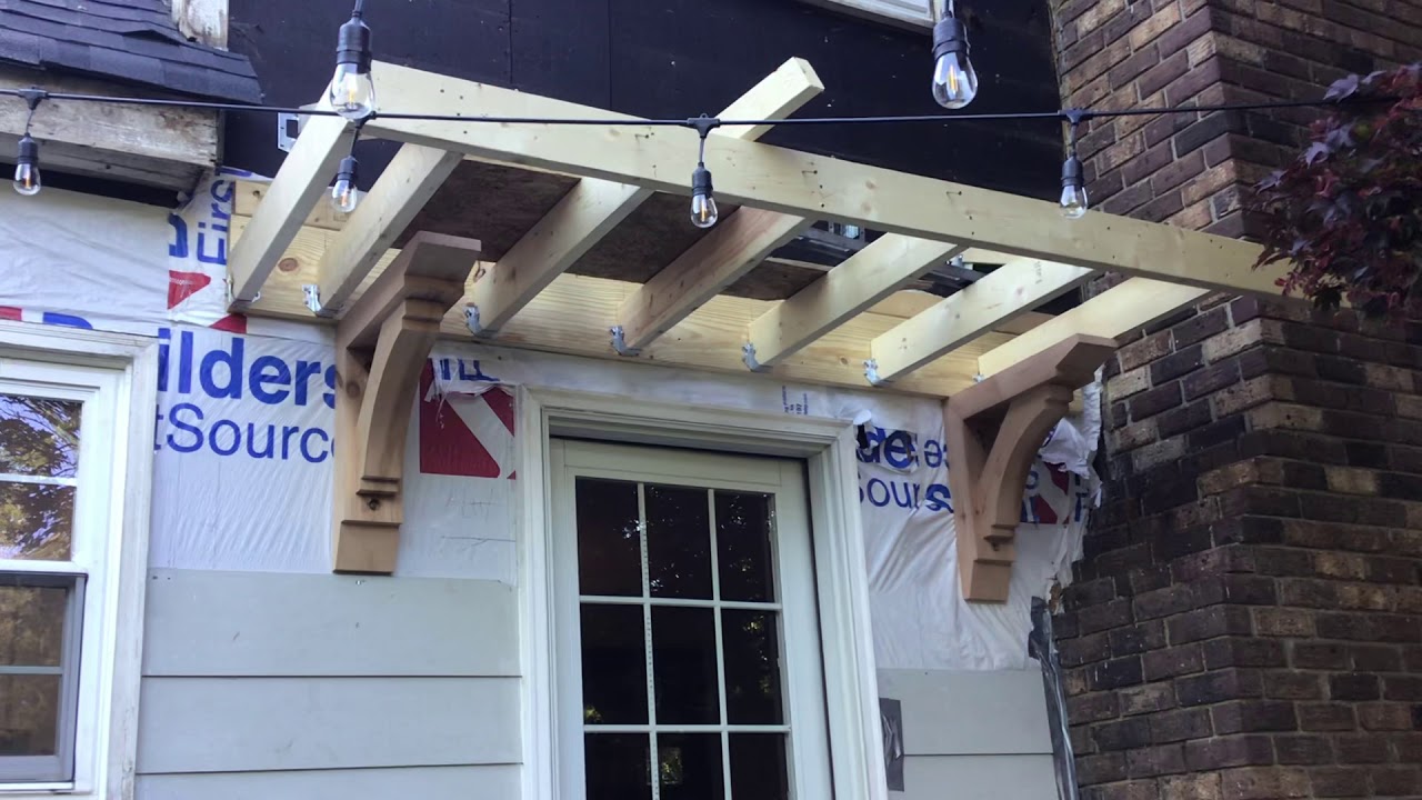 Installed brackets and framing for portico. - YouTube