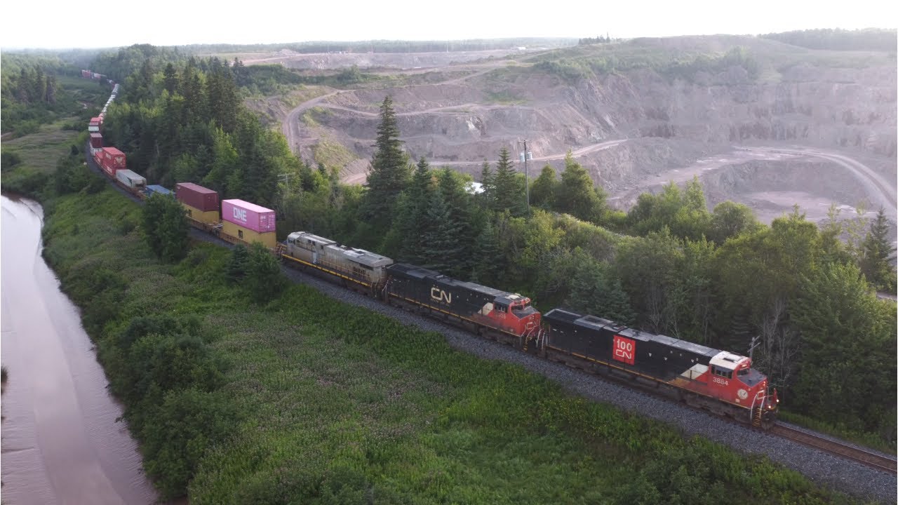 Nice Aerial 4K View! Long & Fast Stack Train CN 120 w/DPU passing Rock ...