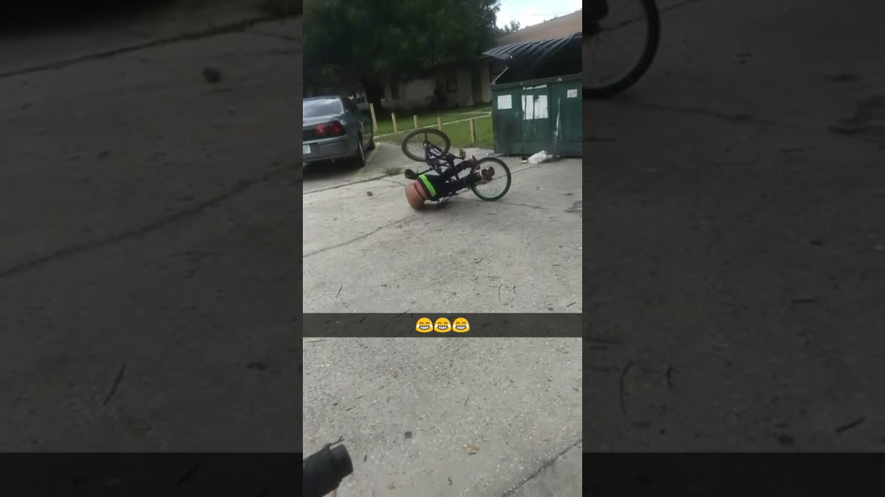 Kid falls off bike after going over ramp - YouTube