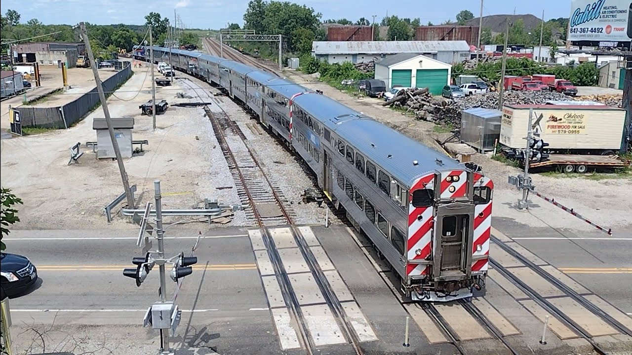 Metra cab-car 8553 east with MP36 414 at Rondout, Illinois on July 26 ...