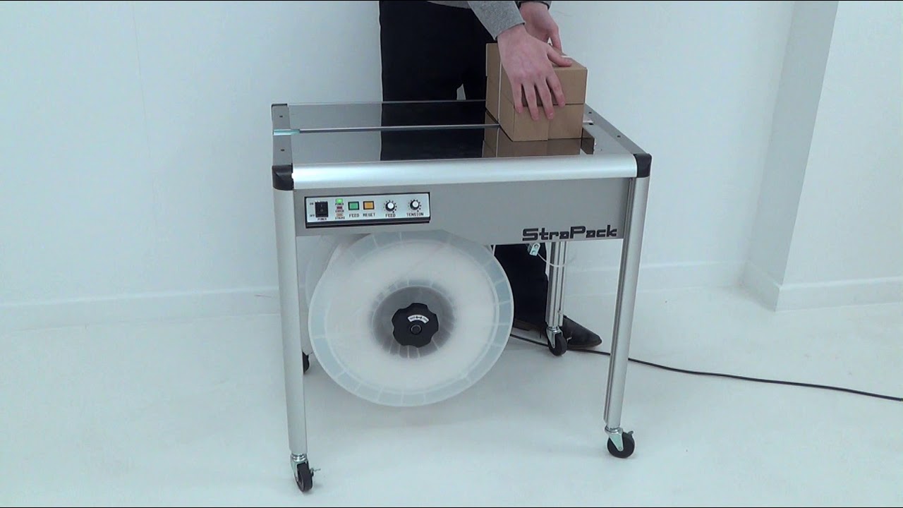 Low cost semi automatic strapping machine - YouTube
