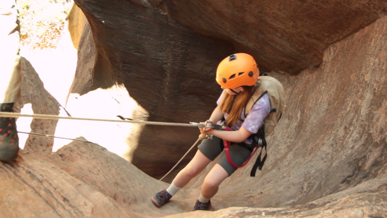 Michka rappelling into a slot canyon - YouTube