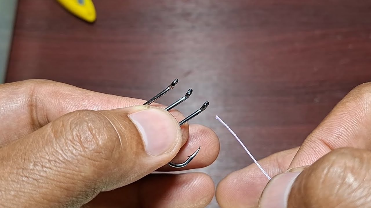 Easy trick in tying fishing hooks, 3 hooks in one straight line. # ...