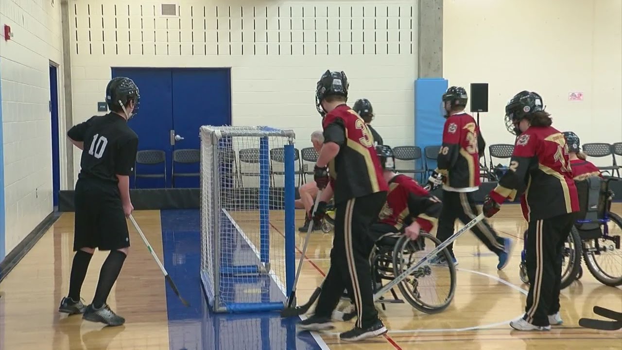 Family Of 10 Adopted Children Revels In Adapted Floor Hockey - YouTube