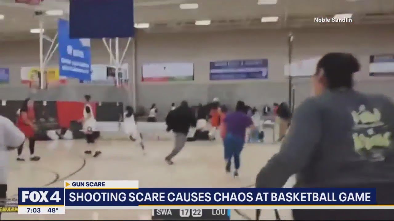 Shooting scare causes chaos at basketball game - YouTube