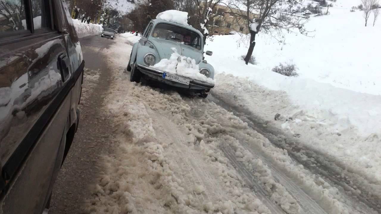 The legend VW Beetle driving over snow - YouTube