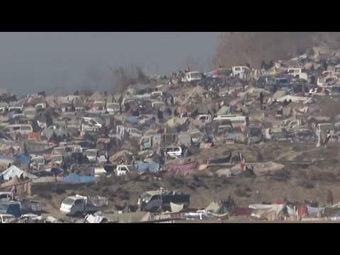 Rare footage shows people walking inside last IS-held territory in Syria's Baghouz