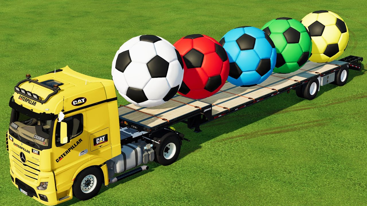 TRANSPORTING OF COLORS! GIANT FOOTBALL BALLS LOADING ON LOW LOADER w ...