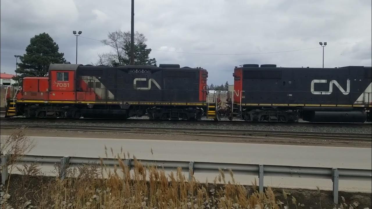 CN Locals EMD GP9RM 7081 GTW GP38-2 5824 & GP38-2W 4770 are backing it up Intermodal Containers ...