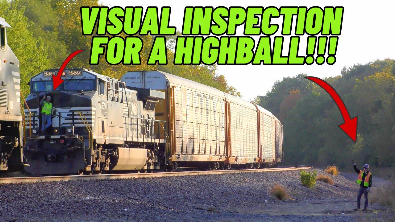 A crew does a visual inspection for a Highball after boarding a train ...