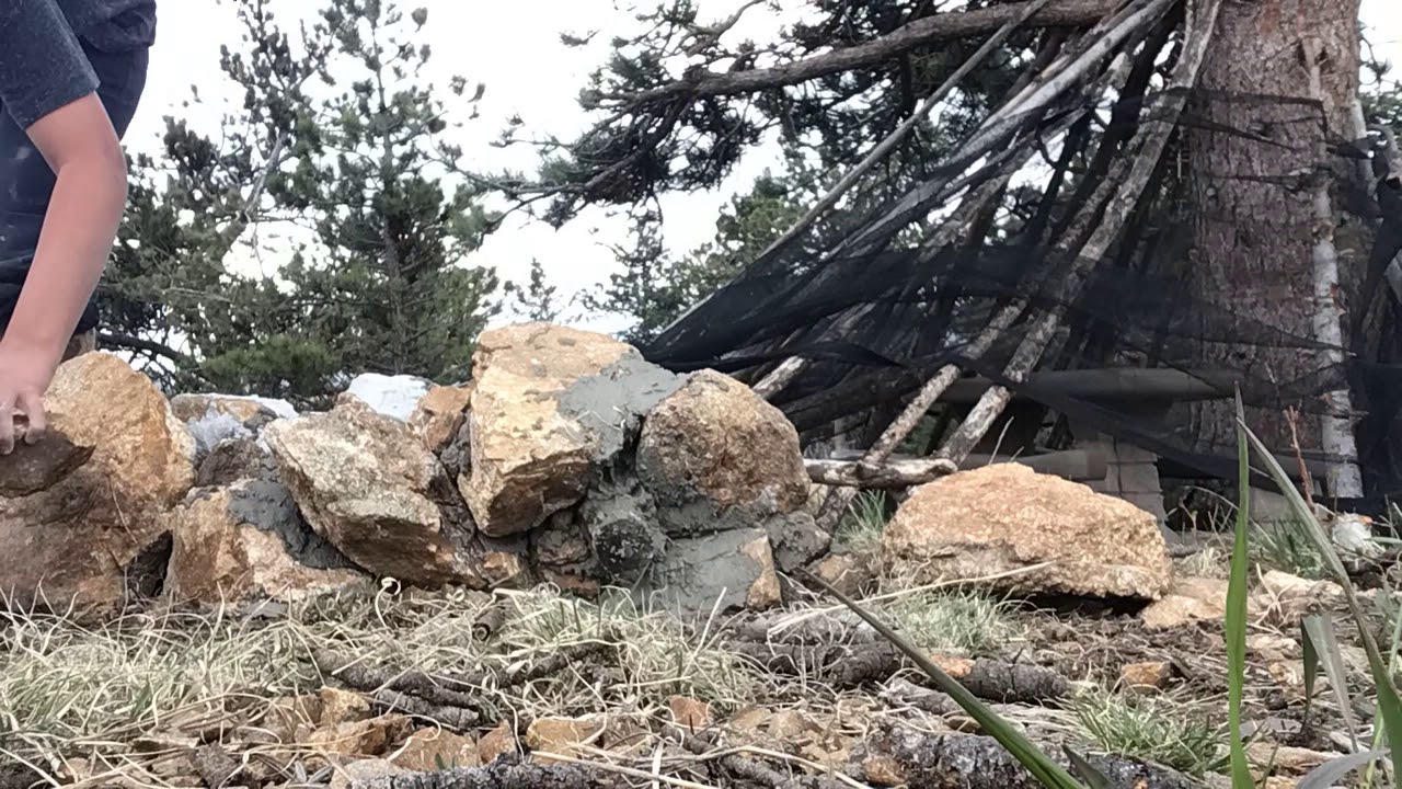 Kid Builds Rock Wall - YouTube