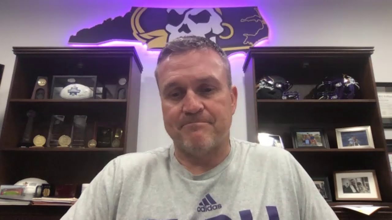 East Carolina Head Football Coach Mike Houston talks with the media ...