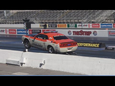 Police drag racing program "Beat the Heat" exhibition at Muscle Car at ...