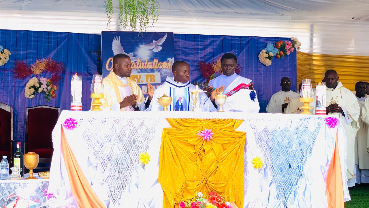 Rev Fr John Mary Ssengabi giving a blessing at his thanksgiving Mass ...