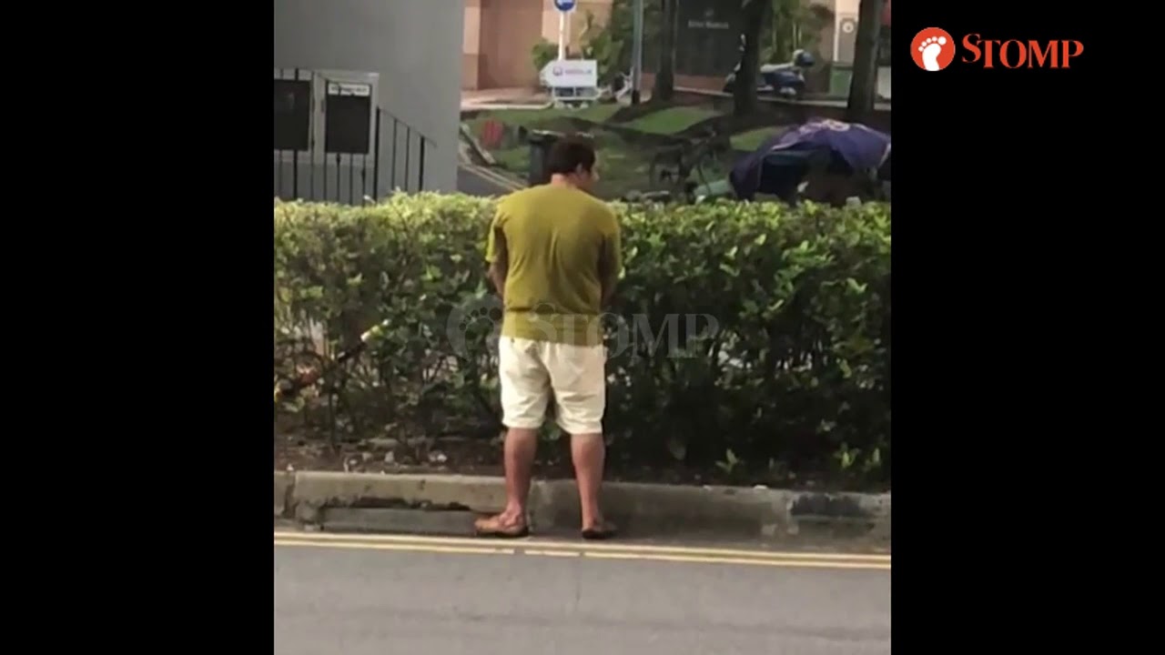 Man pees at roadside along Upper Circular Road in the wee hours of the ...
