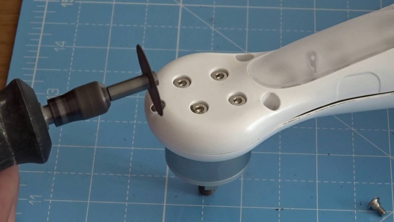Unscrewing a damaged screw head where cross stripped - YouTube