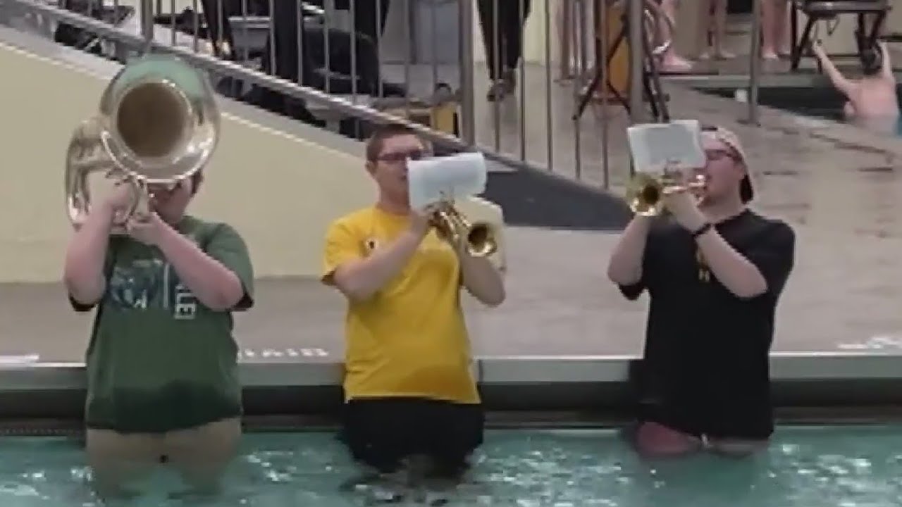 High school band plays in the pool for epic show of school spirit - YouTube