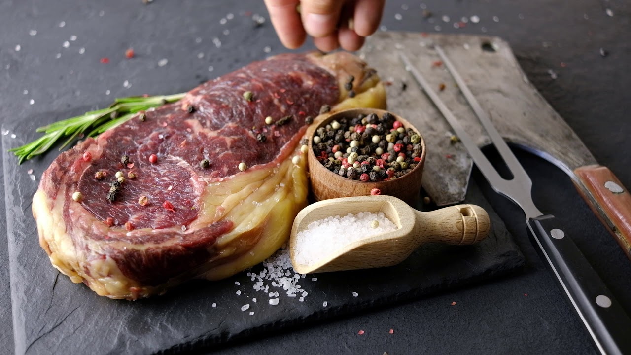 marbling ribeye steak on black plate JH9M8PU - YouTube